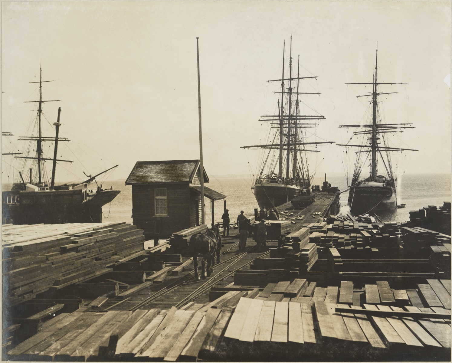 Rockingham jetty showing timber being loaded on ships - JPG 408.1 KB