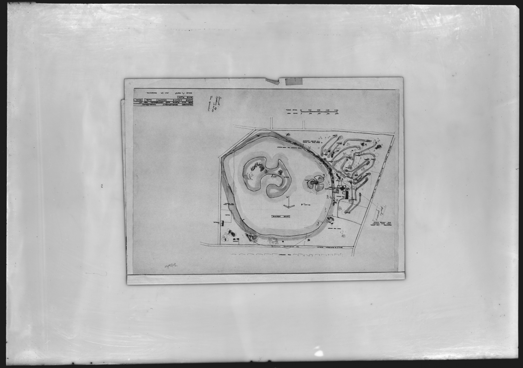 Photographs of the architectural plans for the proposed Lake Adams ...