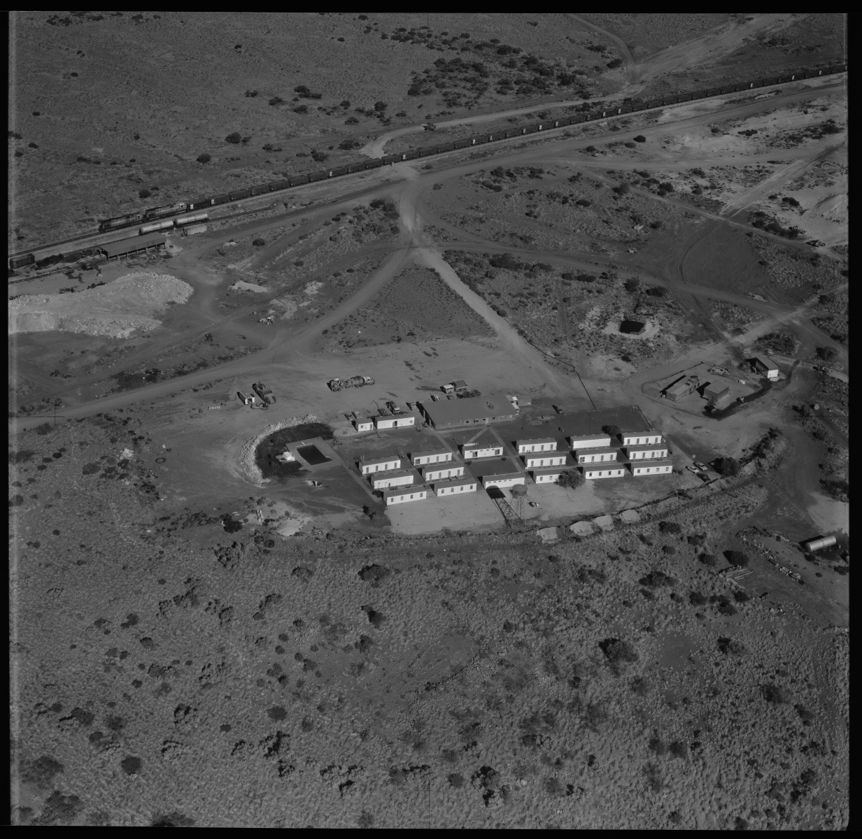 Aerial photographs of the Mt Newman Iron Ore Railroad line camps Cowra ...