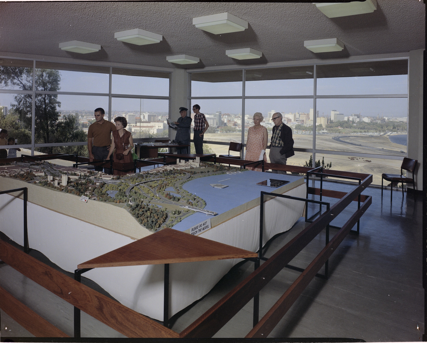 Visitors inspect a scale model of Mitchell Freeway - JPG 559.1 KB