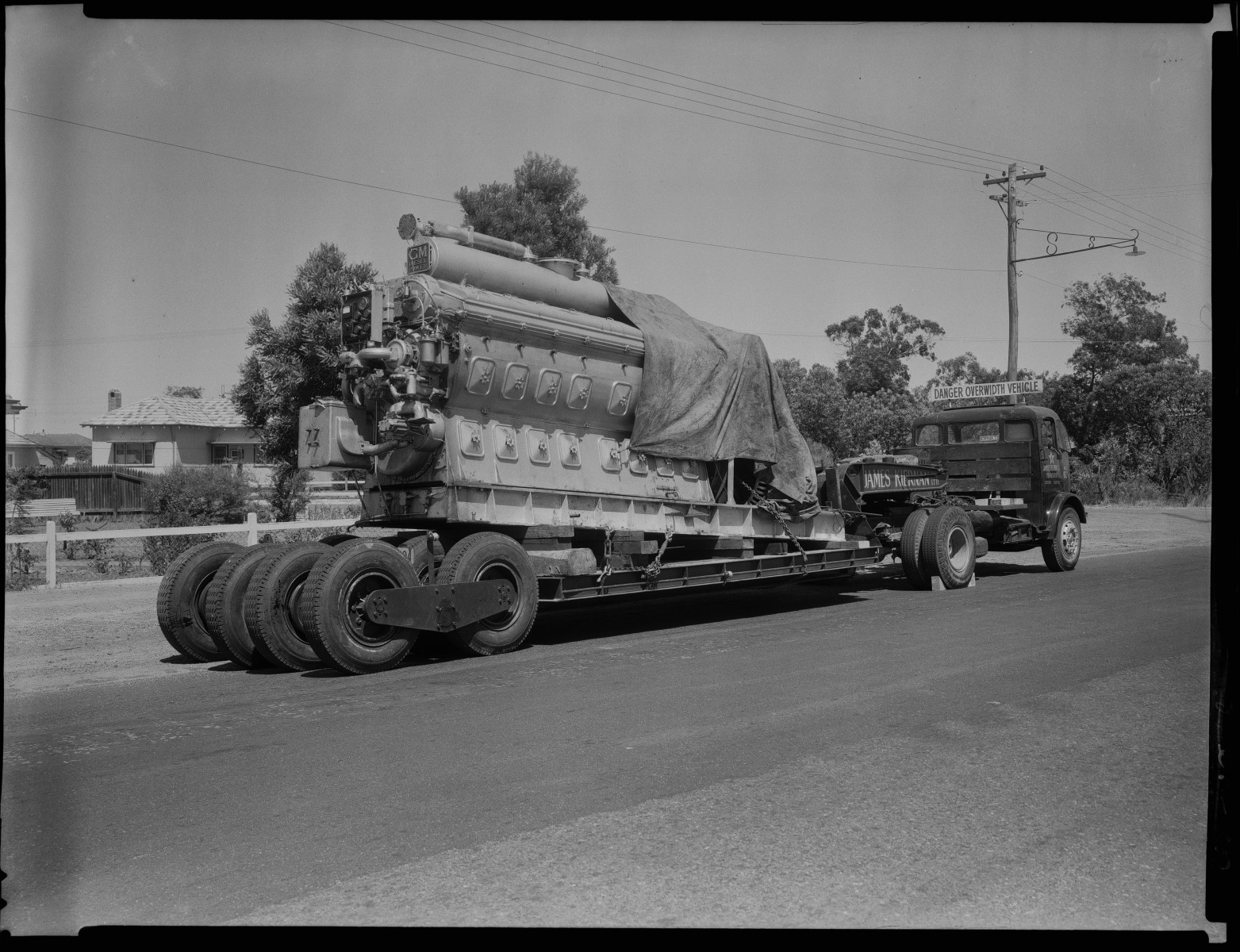 A James Kiernan Pty Ltd truck transporting a large diesel motor and ...