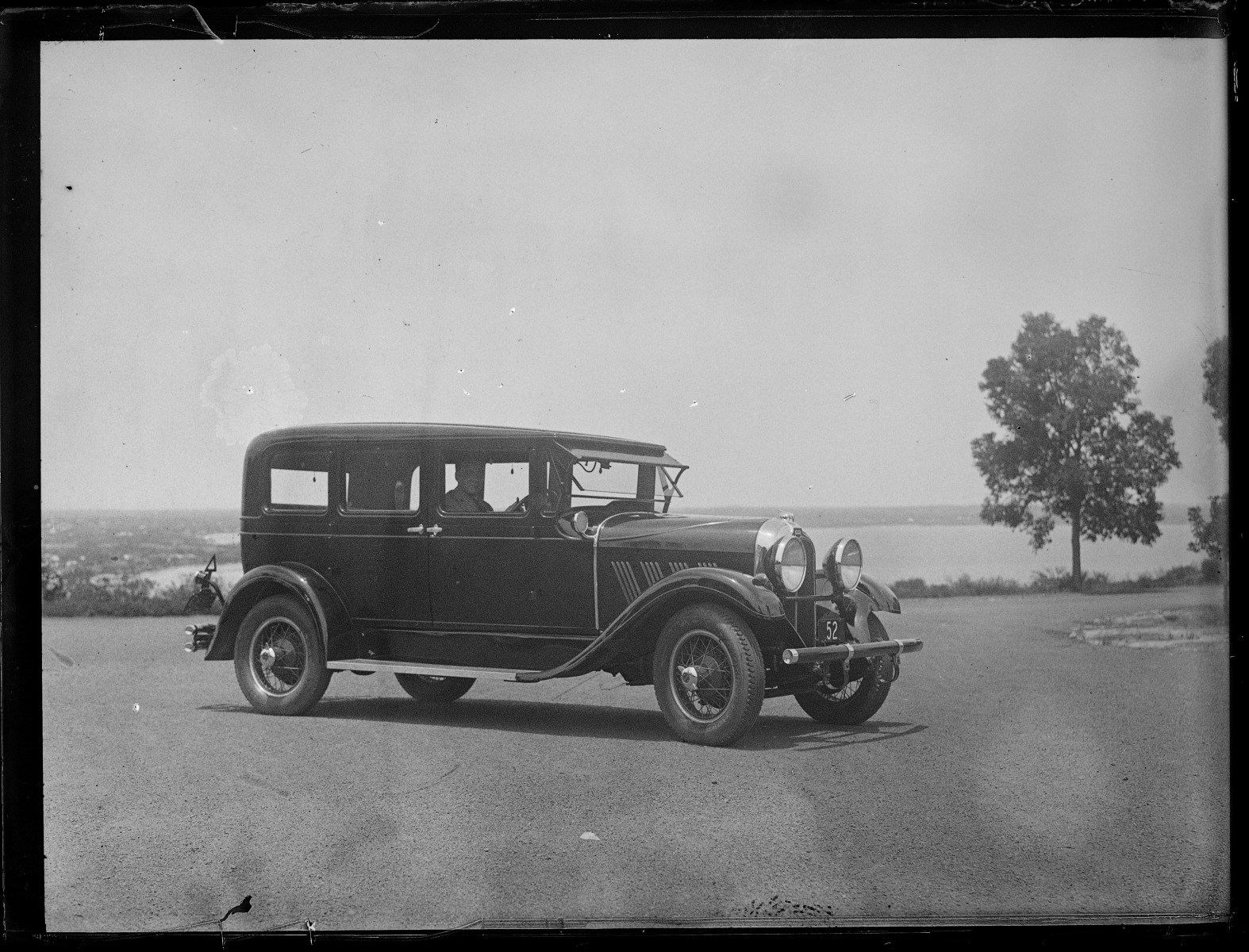 Mr A.E. 'Ted' Lightfoot, W.A. manager for Fox Films with his new car ...