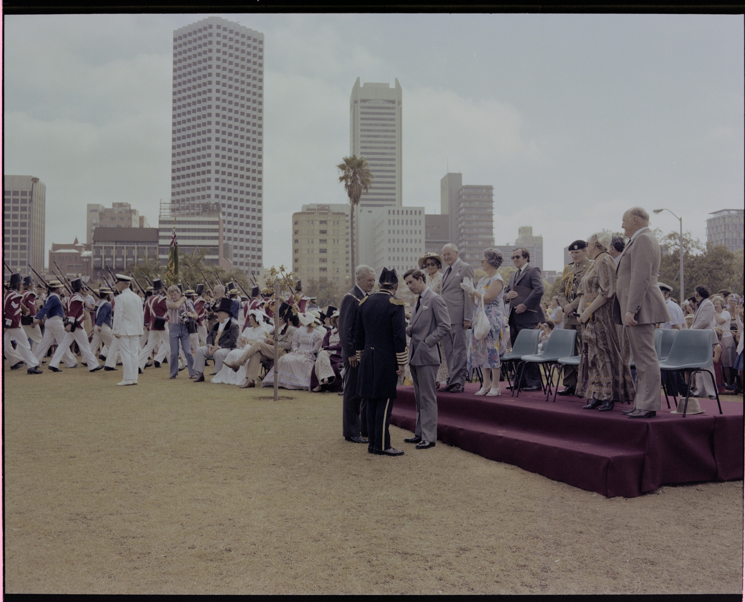 Prince Charles views a re-enactment of the landing of Captain James ...