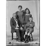 Studio portrait of the Bignell family.