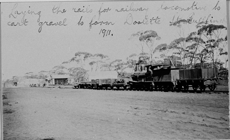 Laying the rails for railway locomotive to cart gravel to form Doolette ...