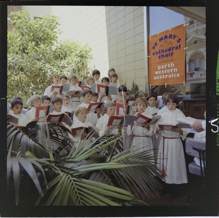 St. Mary's Cathedral Choir sing carols outside the R&I Bank ...