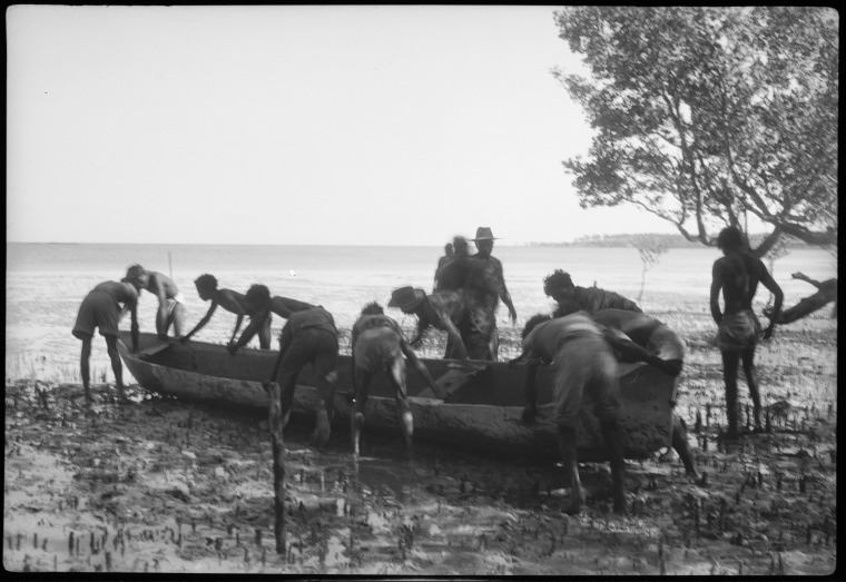 Wargaitj men launching a dug-out, near Delissaville, N.T. - JPG 100.3 KB