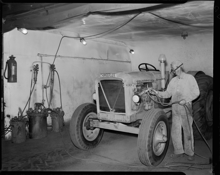 Spray painting a Chamberlain Countryman tractor and tractor parts ...