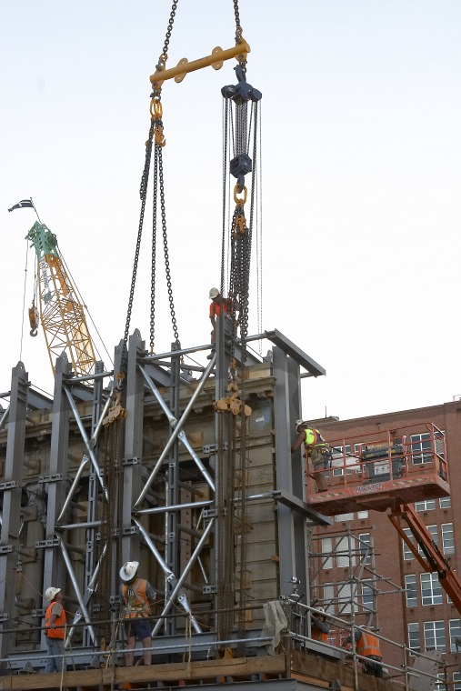 The facade of the Mitchell's Buildings is removed during construction ...