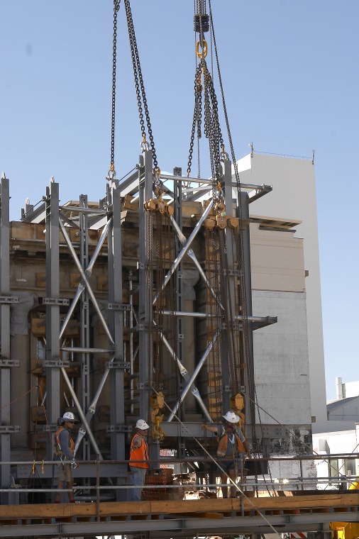 The facade of the Mitchell's Buildings is removed during construction ...