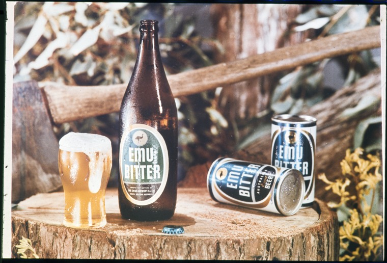 Emu Bitter cans, longneck bottle, and middy beer glass on tree stump ...