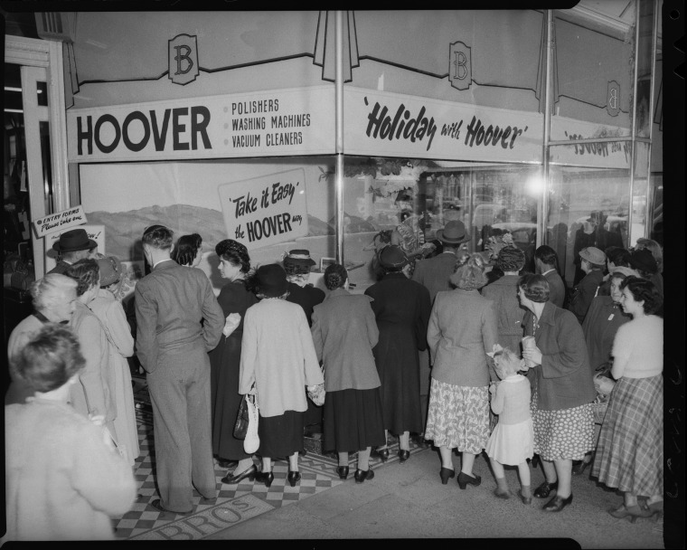 A crowd views the window display for Hoover at Boans department store ...