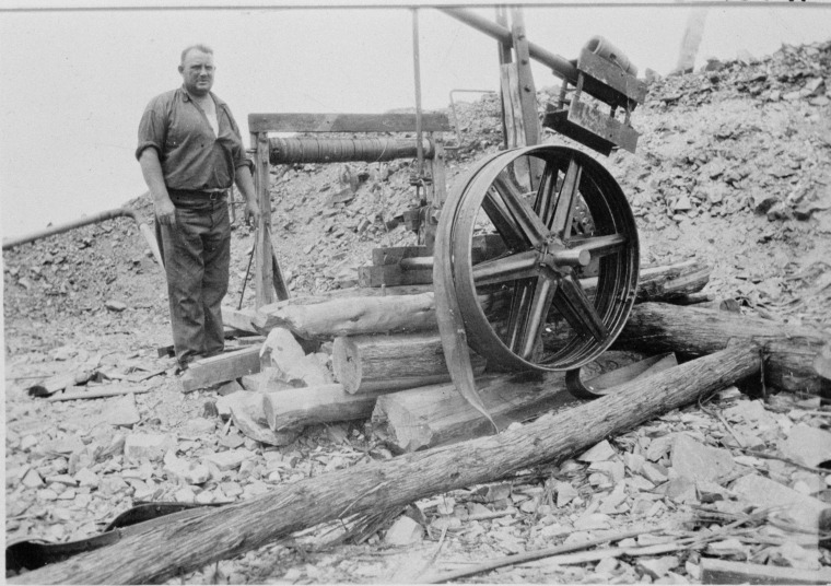 G.P. Ross pumping out water in King Solomon's Mine, Gullewa, G.P. Ross ...