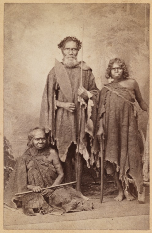 Studio portrait of an Aboriginal Australian man and two women dressed ...