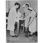 Dr J.H. Stubbe and nurses treat Dr Eric Saint, in Melbourne.