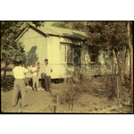 A man photographs the Bodney family outside their home at Allawah Grove.
