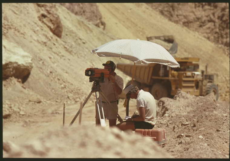 Surveyors working for Roche Brothers at an open cut gold mine in ...