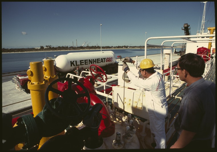 The LPG tanker ship Gas Energy unloading into gas tanker trucks at ...