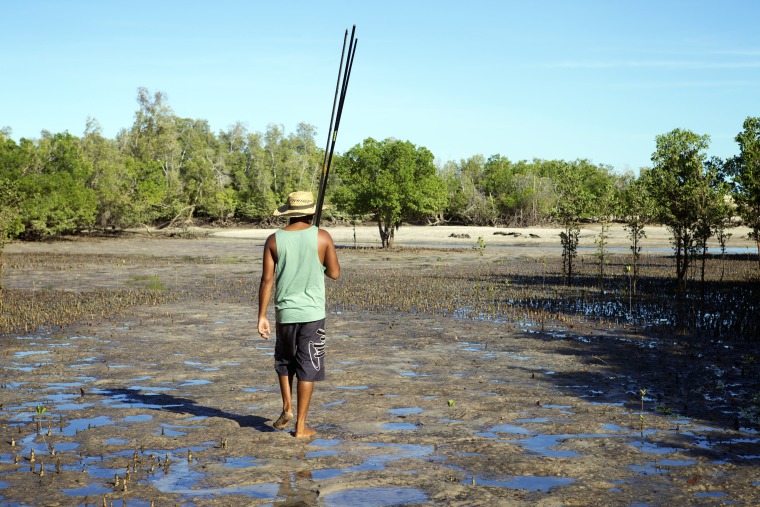 Hunting with spears along the coast at One Arm Point, 1 April 2013 ...