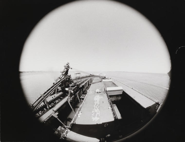 Fisheye perspectives of iron ore being loaded at Parker Point (Dampier ...