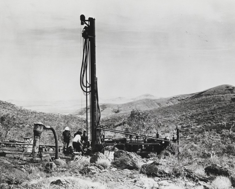 Drilling in preparation for blasting on the orebody at Mt Tom Price ...