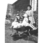 Gladys Vincent with children in a wheelbarrow at Roelands Native Mission.