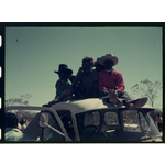 Young Aboriginal men sitting on top a car, Derby, Western Australia.