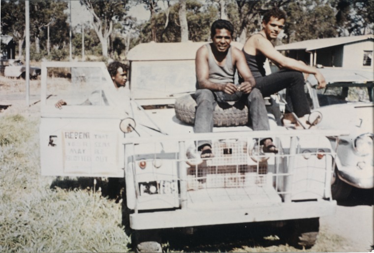 Three young Aboriginal men with Ron William's Land-Rover, Western ...