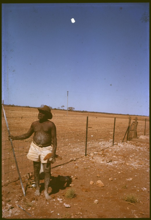 Old Possum drilling holes to be dynamited for planting trees. - JPG 93.4 KB