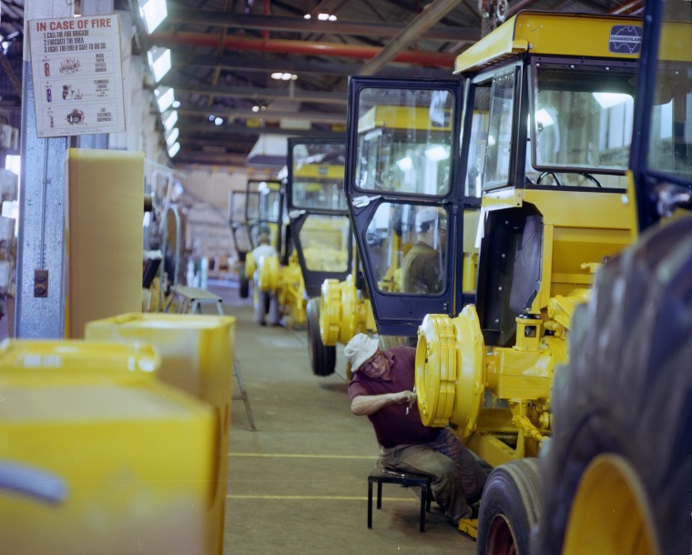 Building tractors at the Chamberlain John Deere factory, Welshpool, 24 ...