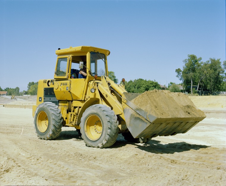 John Deere JD444 front end loader at work building a road, 28 January ...