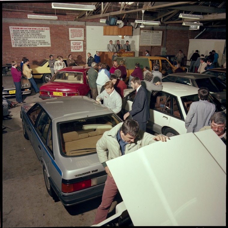 An auction underway at Town Auto Auctions, 48 Wellington Street, East ...