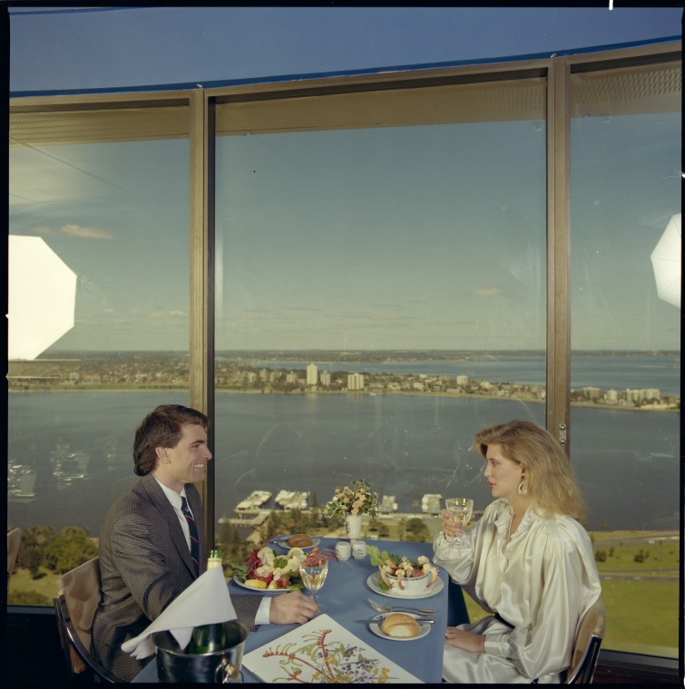 A couple eat in Hilight 33, the revolving restaurant at the top of St ...