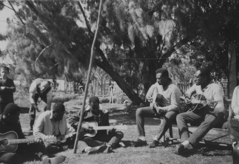 Bill Tapim and Douglas Malakai with a group of Torres Strait Islanders ...