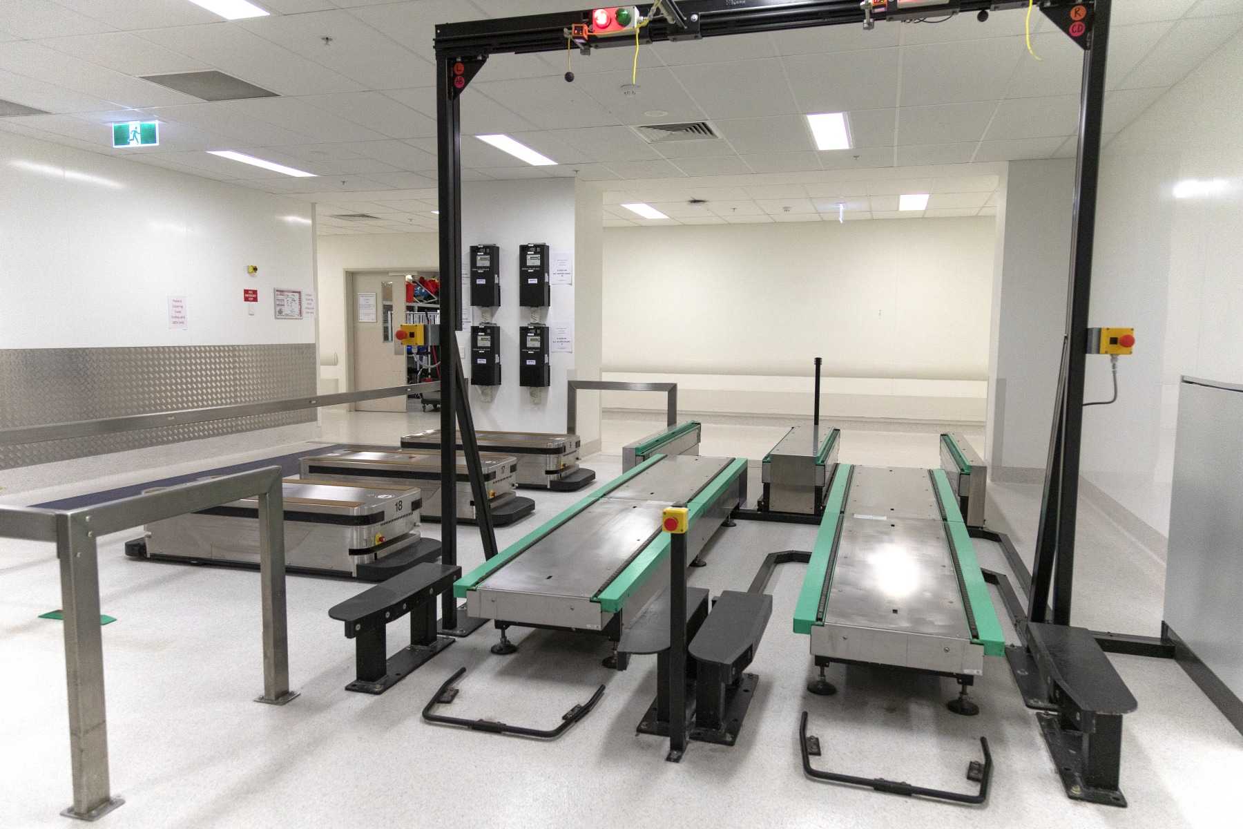 Automated guided vehicle (AGV) dock for meal trolleys on the lower ...