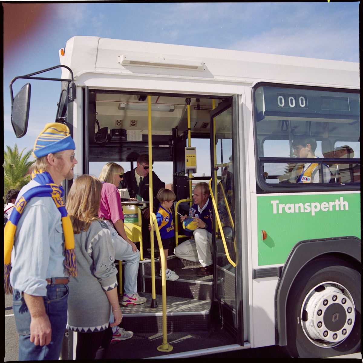 West Coast Eagle Dean Kemp with a family catching a bus to the football ...