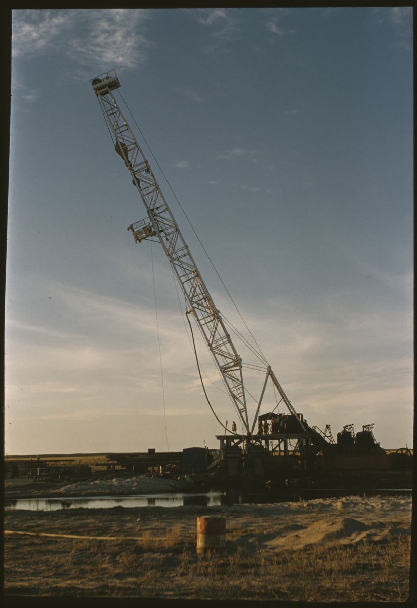 Lowering oil rig, possibly at Samphire Marsh No. 1, Western Australia ...